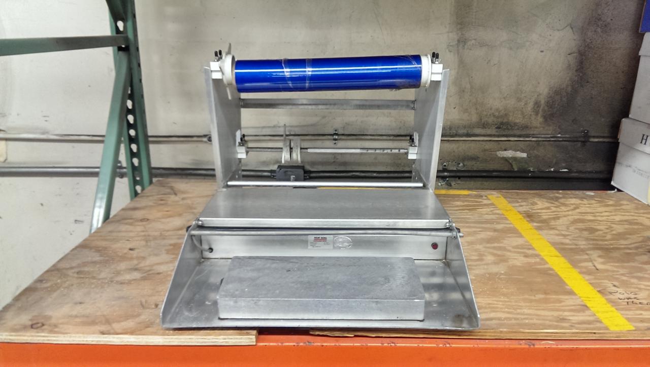 Lot #22: HeatSeal 825A Table Top Wrapper - WireBids